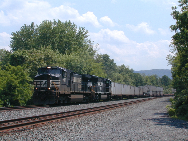 A westbound NS van train with a brand new SD70M as the trailing engine on the ex PRR
